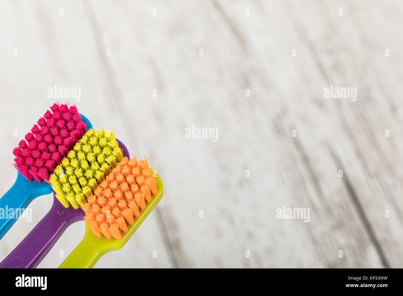 New color ultra fine toothbrushes in colorful glasses. Dental Industry ...