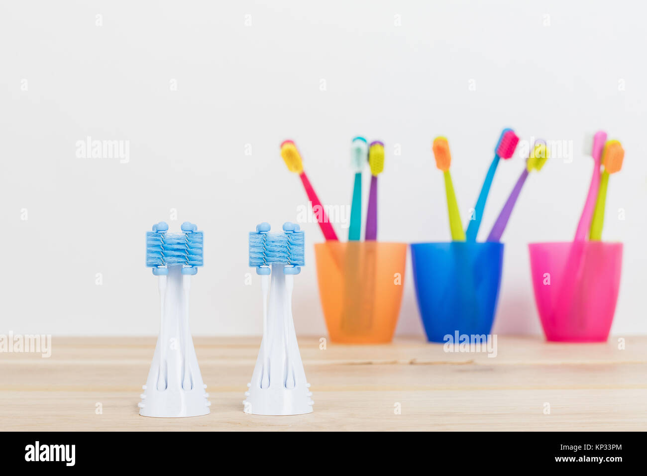 Ultra fine toothbrushes in colorful glasses and electric modern tooth ...