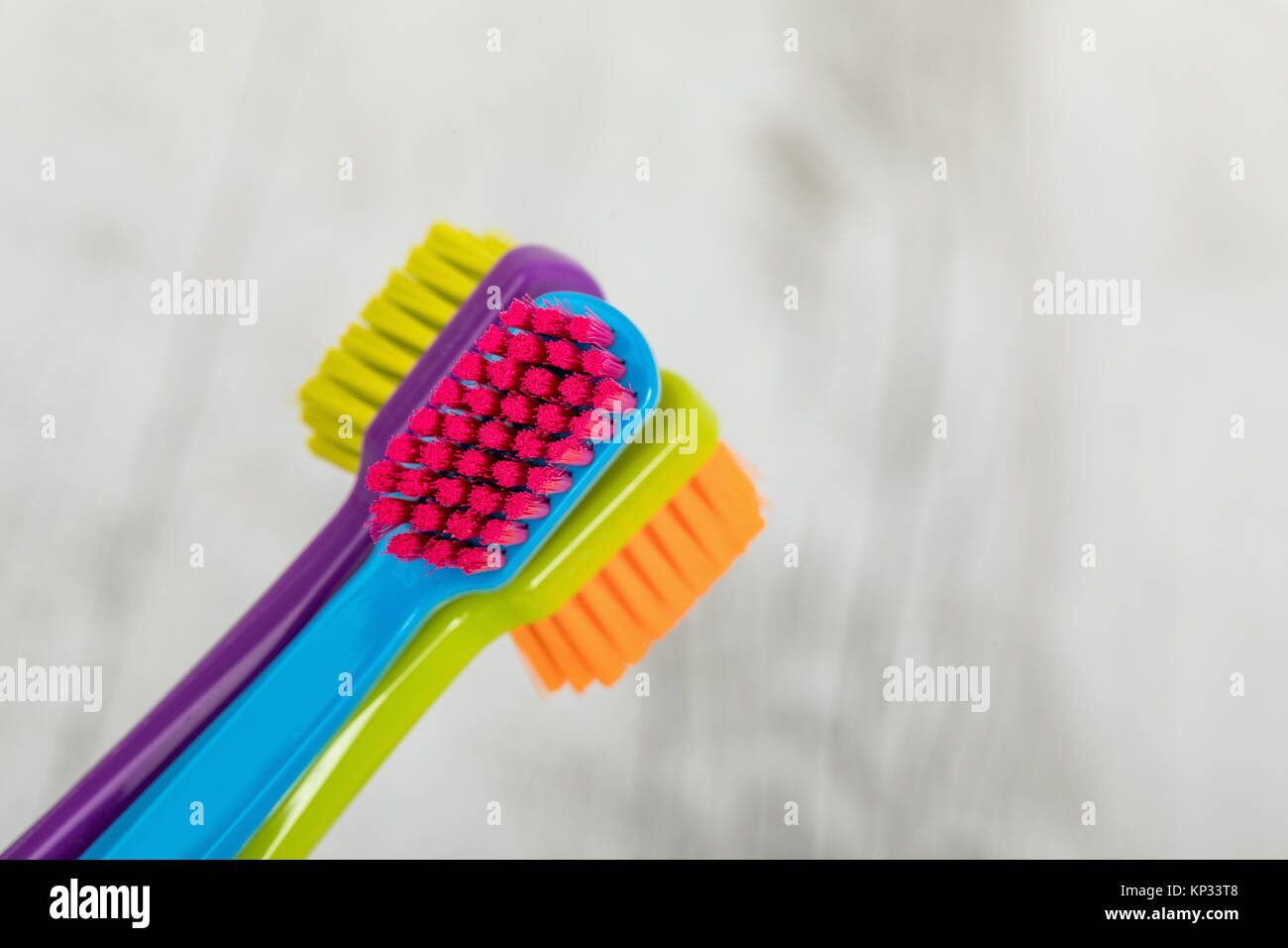 New color ultra fine toothbrushes in colorful glasses. Dental Industry ...