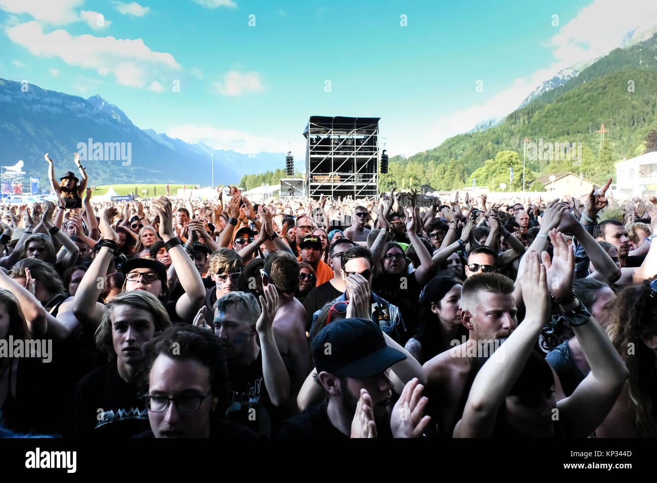 Festival goers attend a live concert with the German power metal band ...