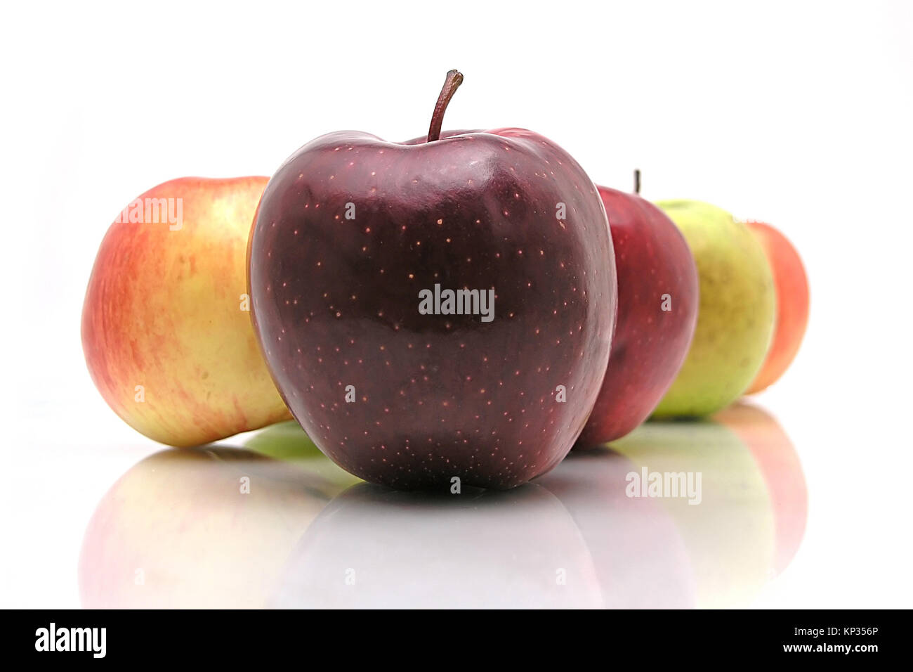 Several apples on white glass Stock Photo - Alamy