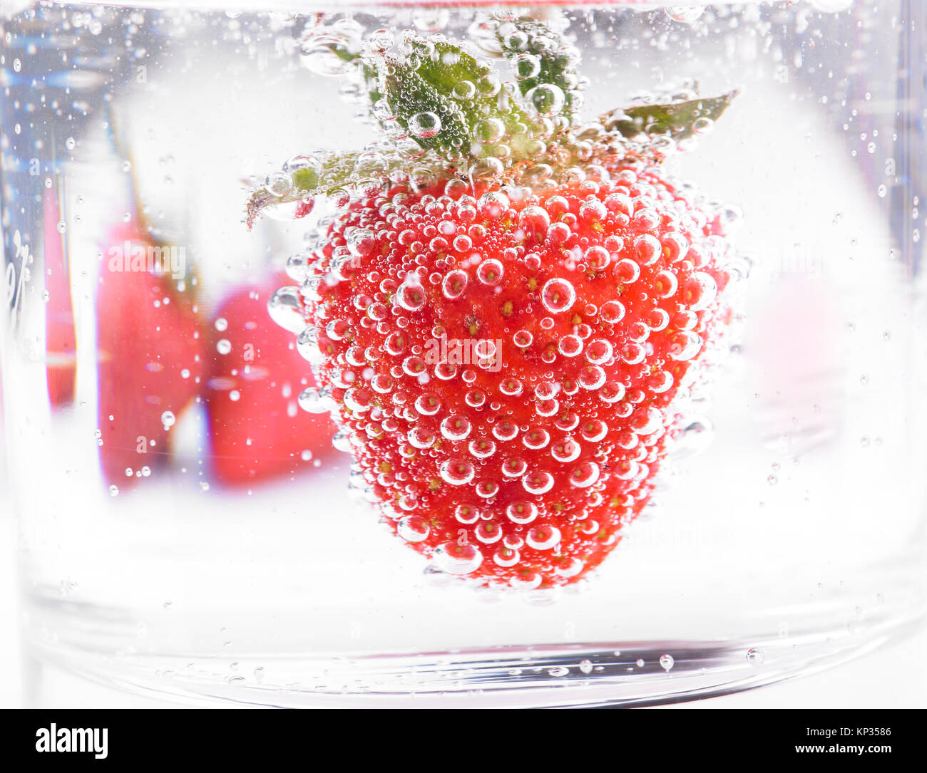 Fresh Strawberry in Mineral water with boobles Stock Photo - Alamy