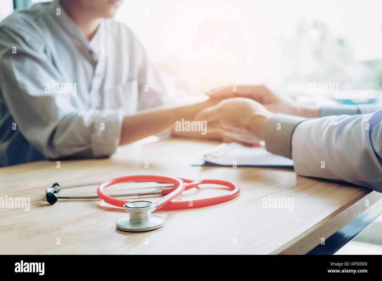 Doctor holding hands hi-res stock photography and images - Alamy