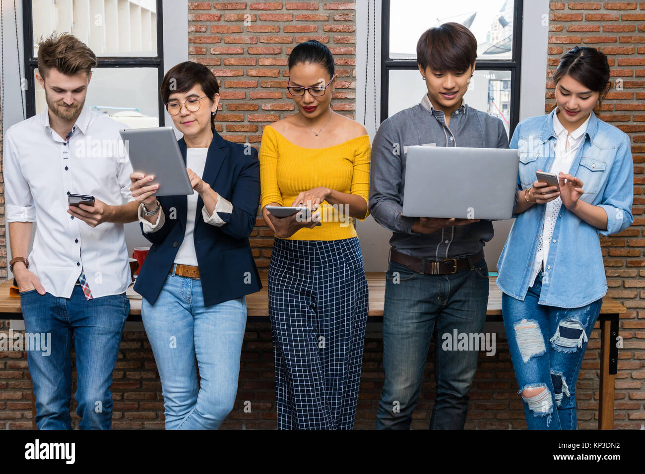 Group Of Asian and Multiethnic Business people with casual suit using ...