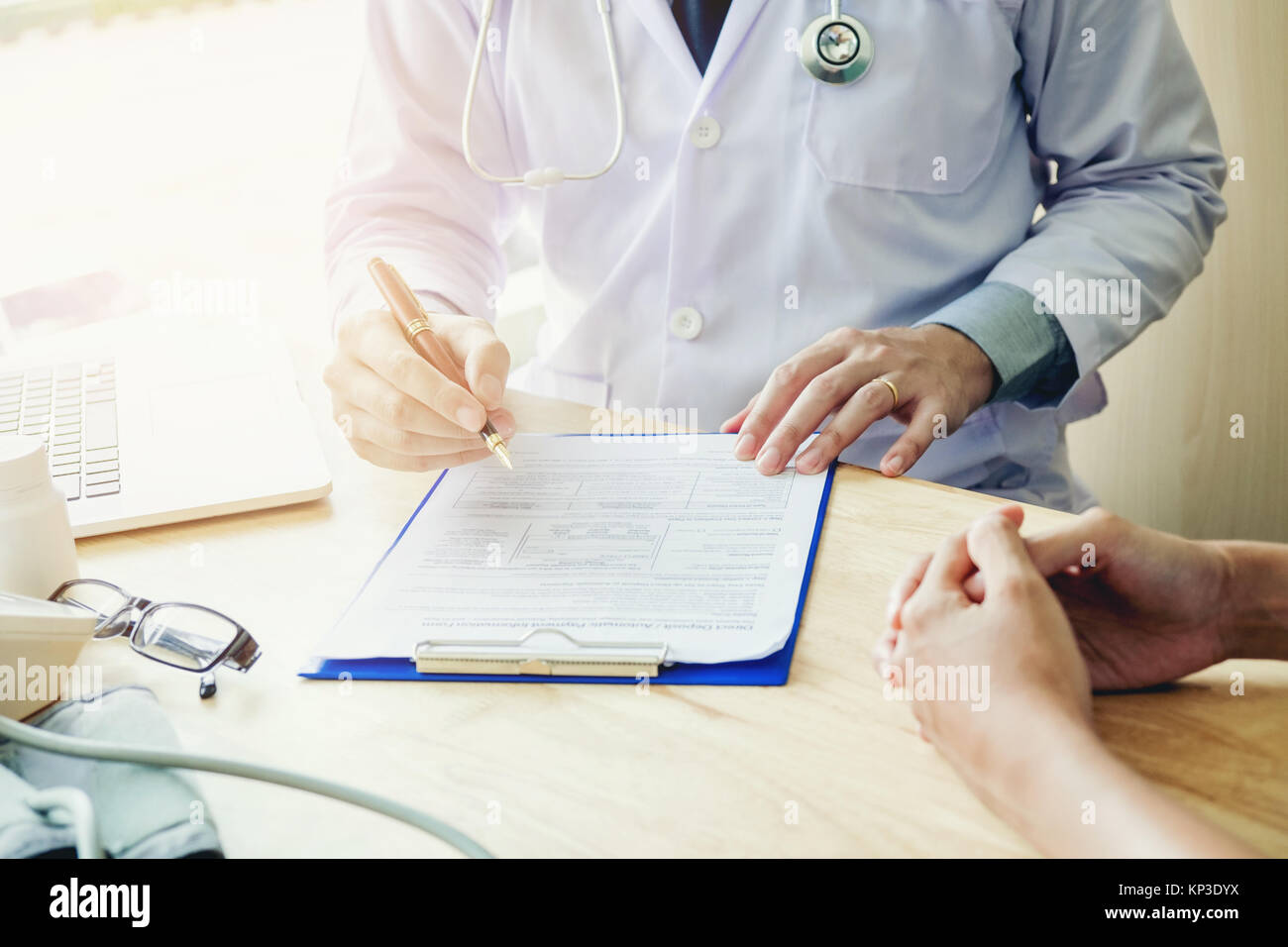 Doctors and patients sit and talk to the patient about medication. At ...