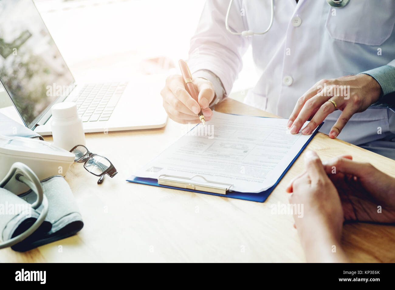 Doctors and patients sit and talk to the patient about medication. At ...