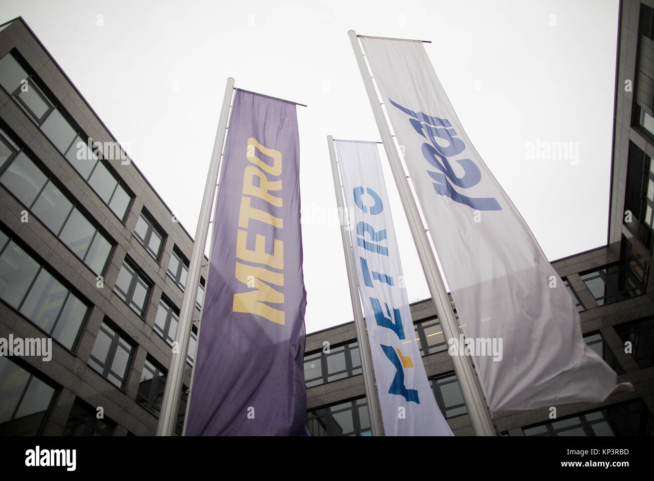 Flags with the logos of Metro Cash&Carry (l-r), Metro AG and Real are ...