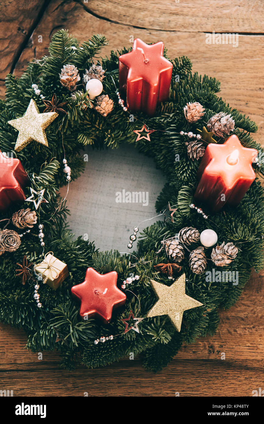 Lighting the first candle on Advent wreath four weeks before Christmas ...