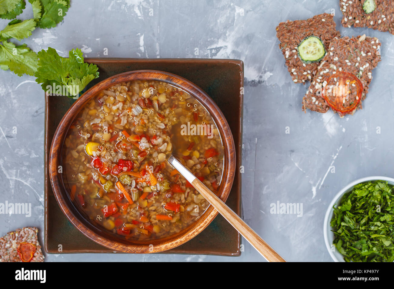 Peruvian soup with quinoa, red rice and lentils in a wooden bowl with ...