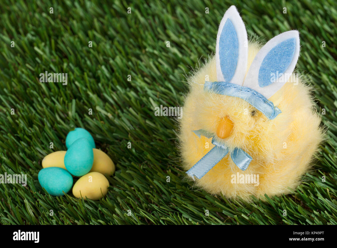 blue bunny staring at the easter eggs Stock Photo - Alamy
