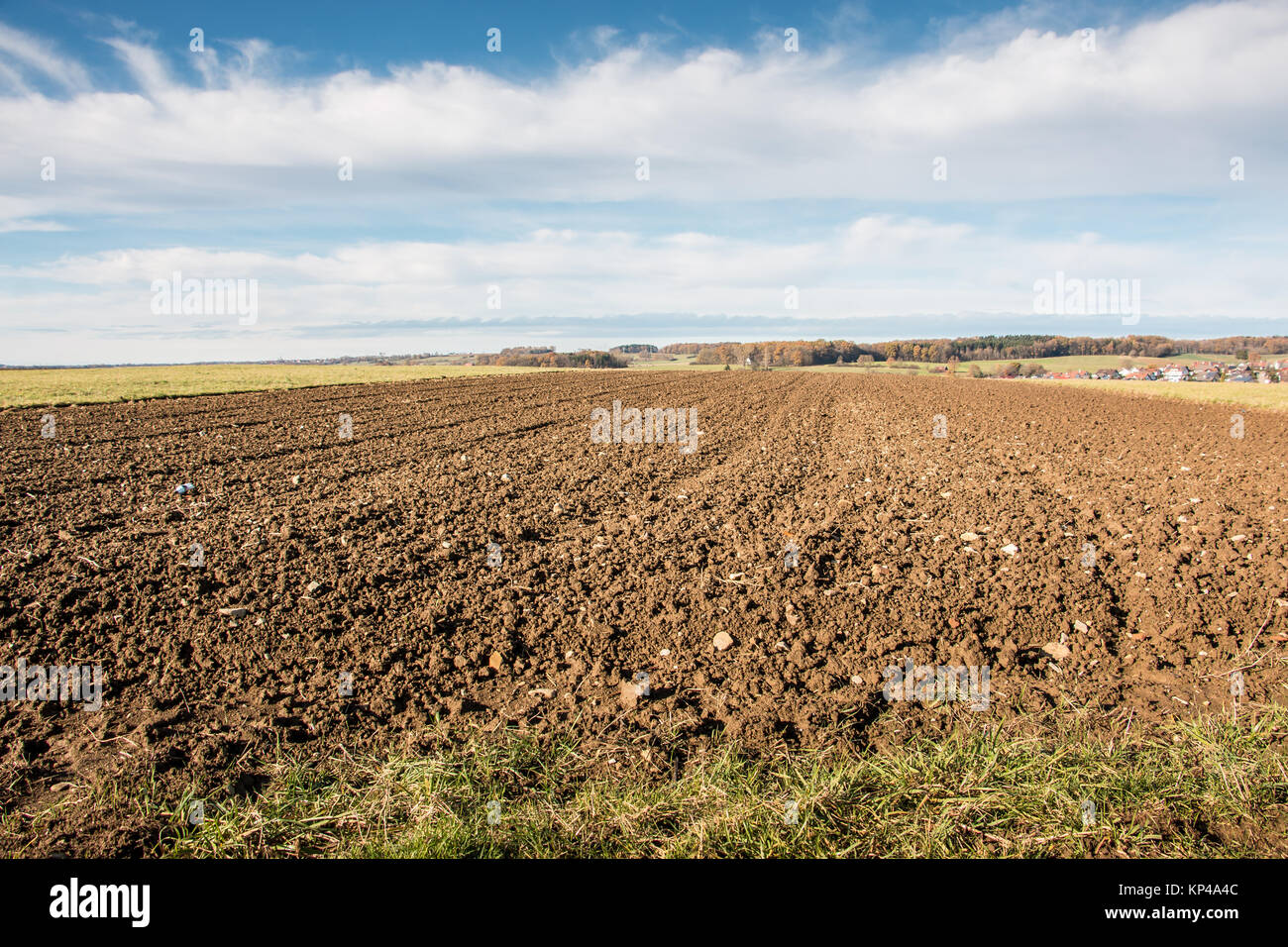 Fertile fields and green and brown soil Stock Photo - Alamy