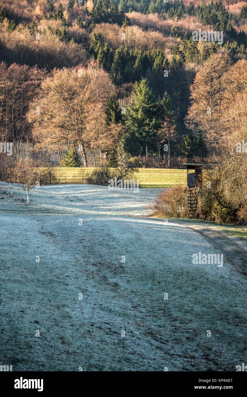 Winter mood and raised hide on an icy field Stock Photo - Alamy
