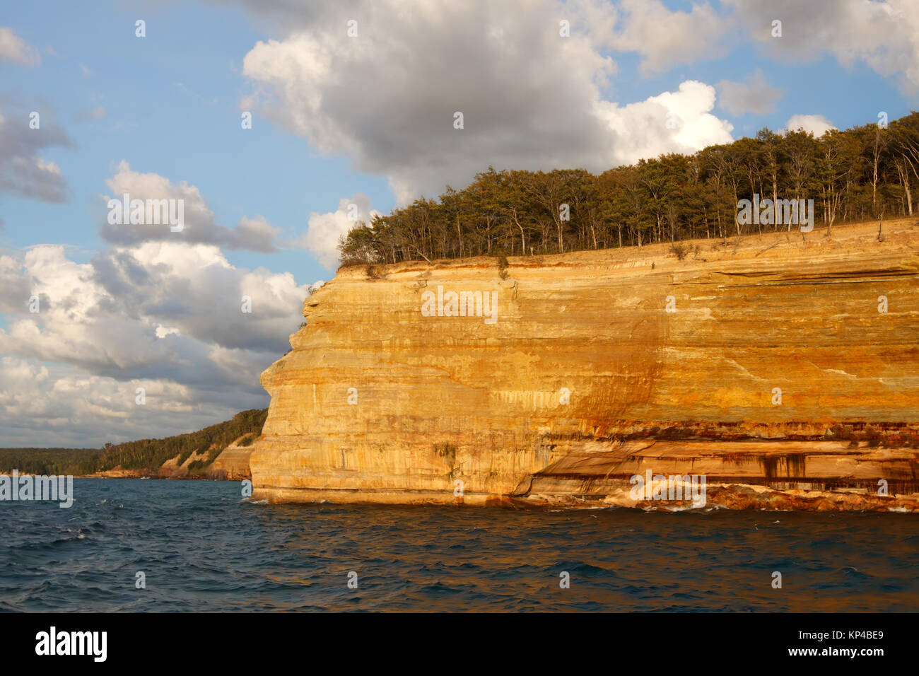 Pictured Rocks National Lakeshore in evening sunlight.These colorful ...