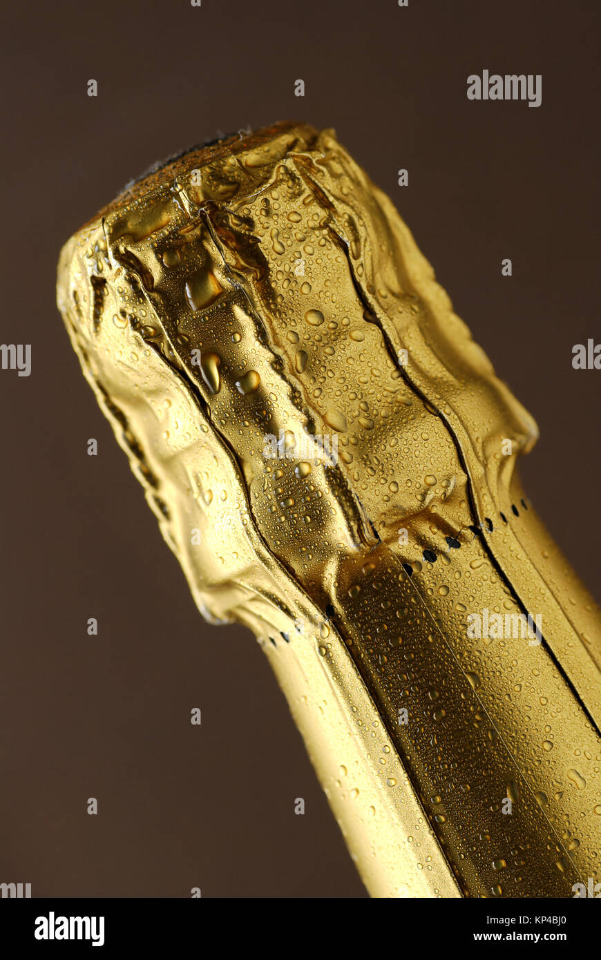 close up of foil covered champagne cork Stock Photo - Alamy