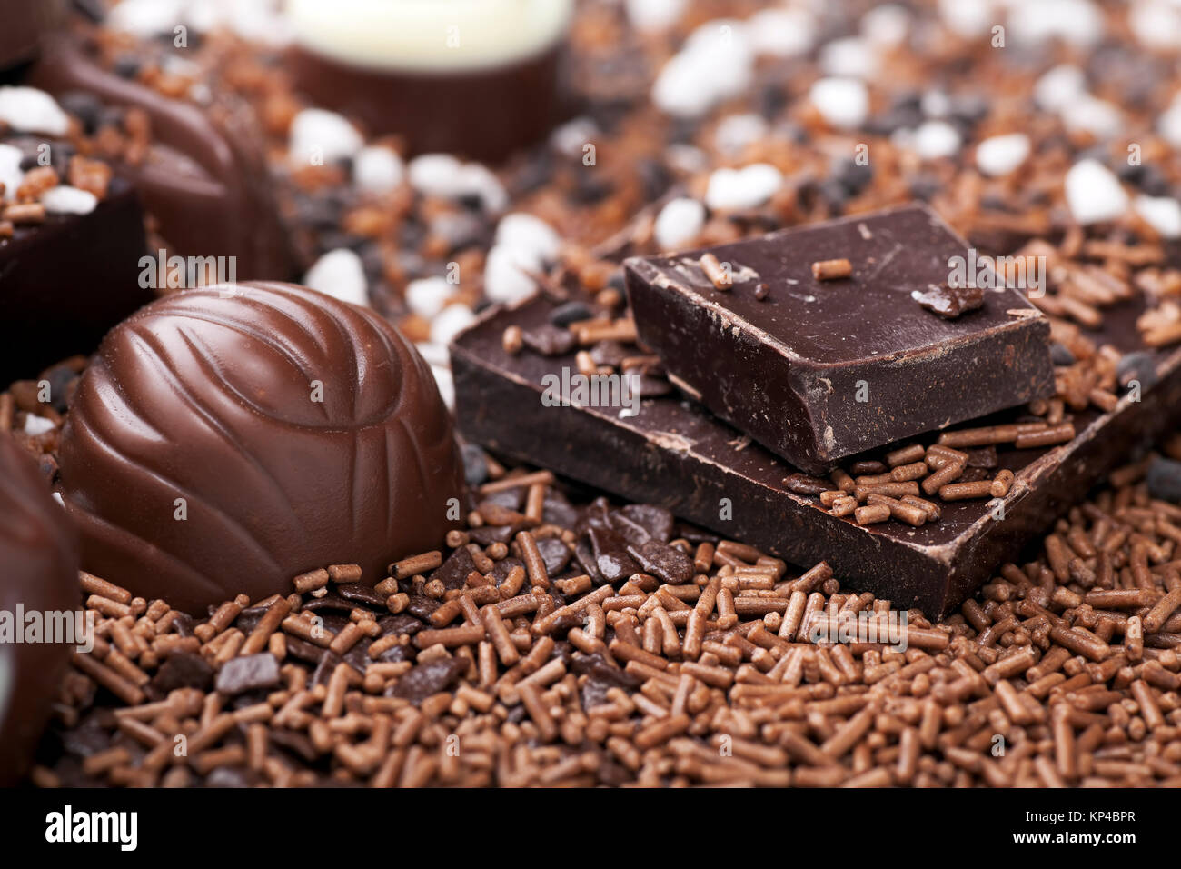 Closeup of chocolate sprinkles chocolate bars and pralines Stock Photo ...
