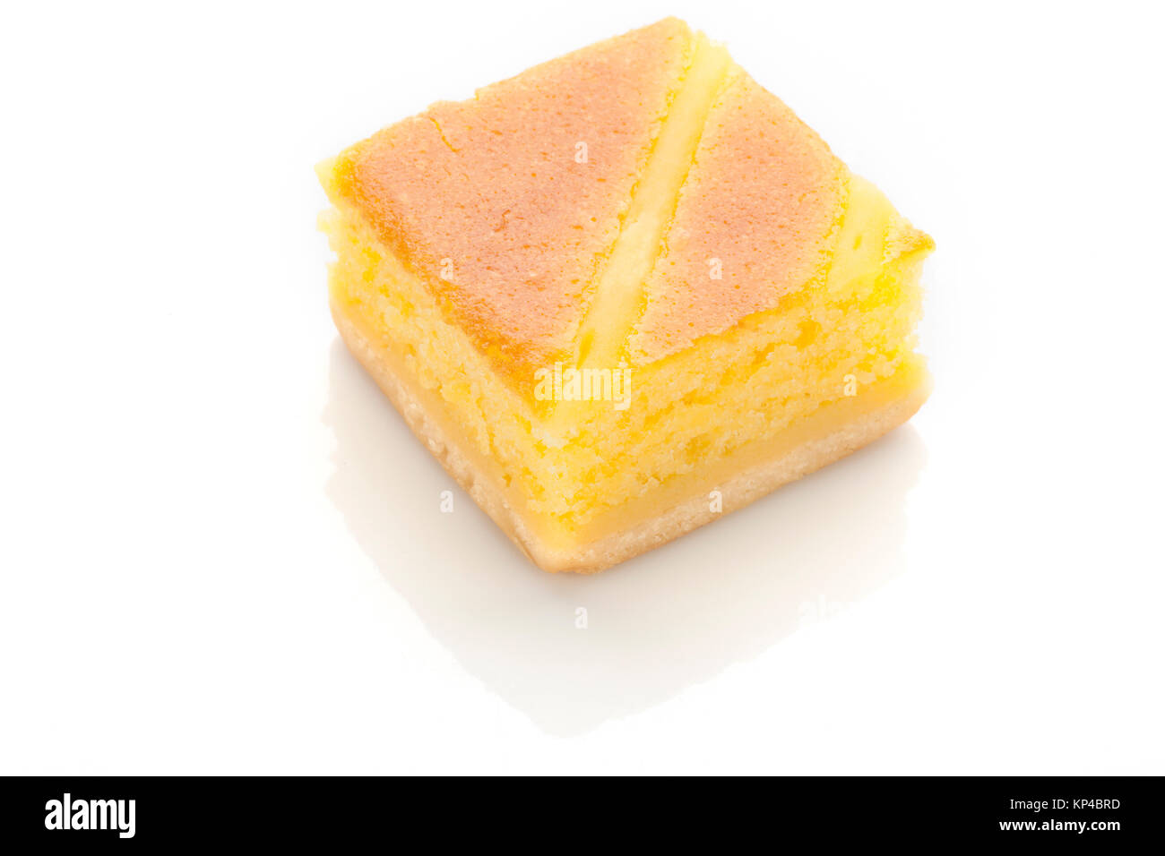 Sqare slice of yellow cake isolated on white Stock Photo - Alamy