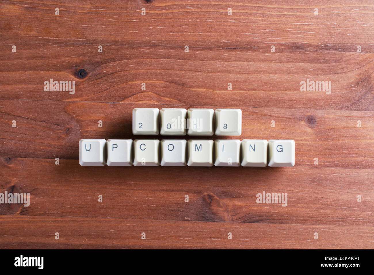 Upcoming New year 2018. Flat lay view from above on the table with computer keyboard keys ...