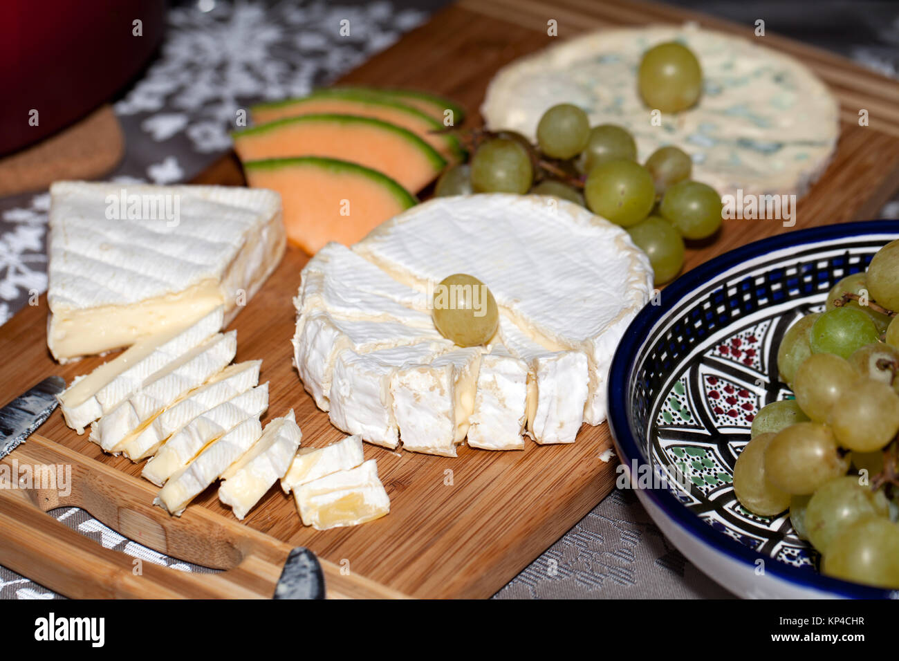 Cheese with white grapes . Close up Stock Photo - Alamy