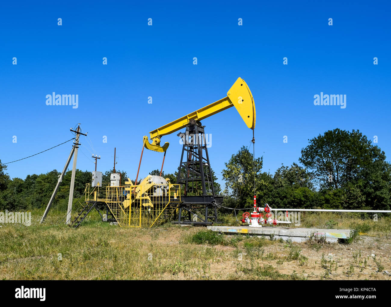 The pumping unit as the oil pump installed on a well. Equipment of oil ...
