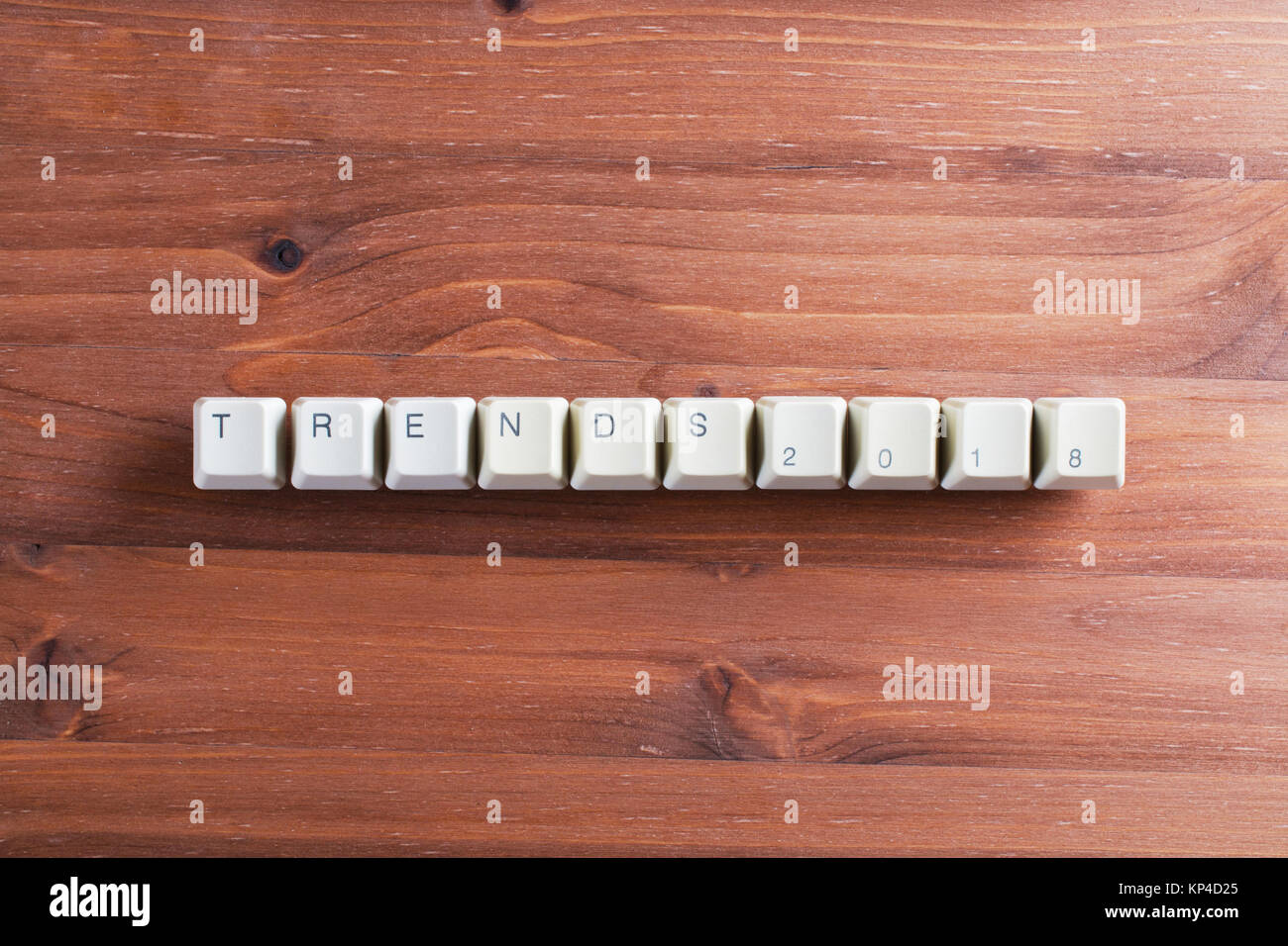Trends 2018. Flat lay view from above on the table with computer keyboard keys buttons on a ...