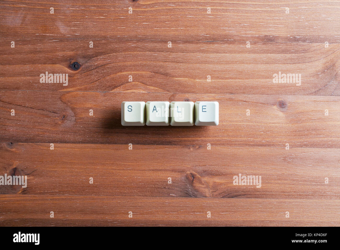Sale word concept. Flat lay view from above on the table with computer keyboard keys buttons on ...