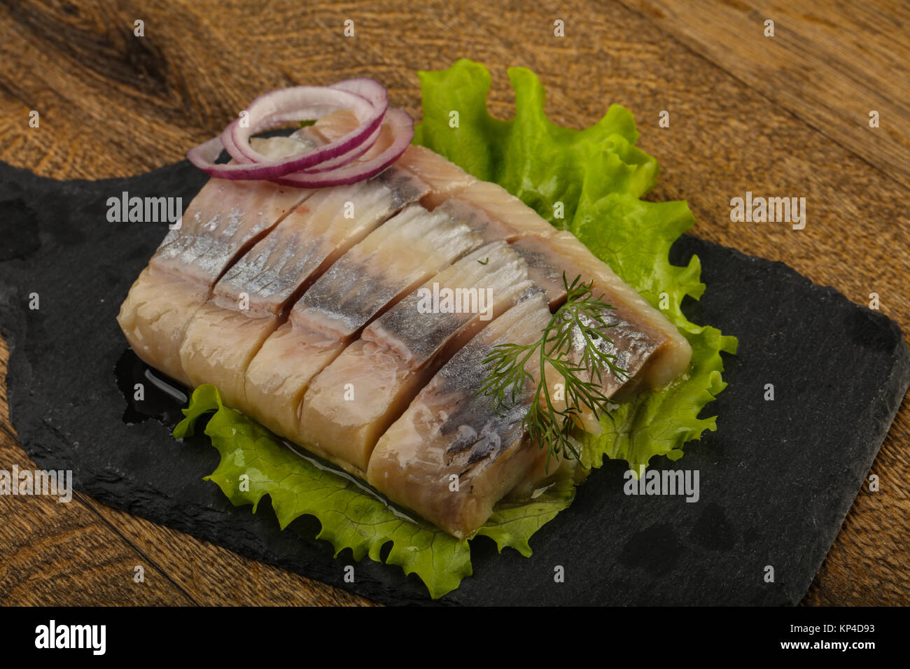 Sliced Herring fillet with dill and onion Stock Photo - Alamy