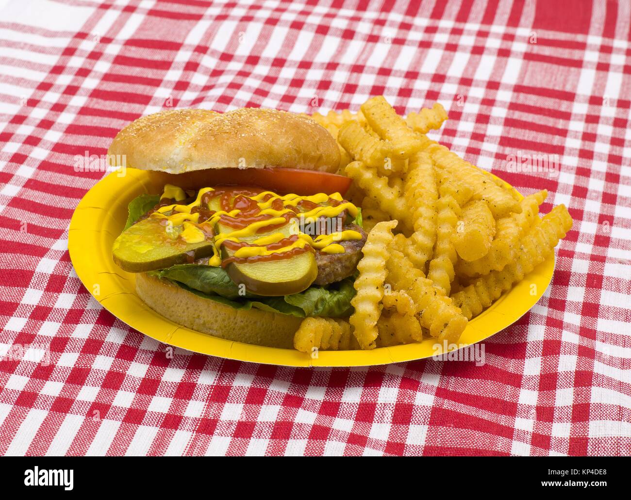 burger and fries on picnic table Stock Photo - Alamy