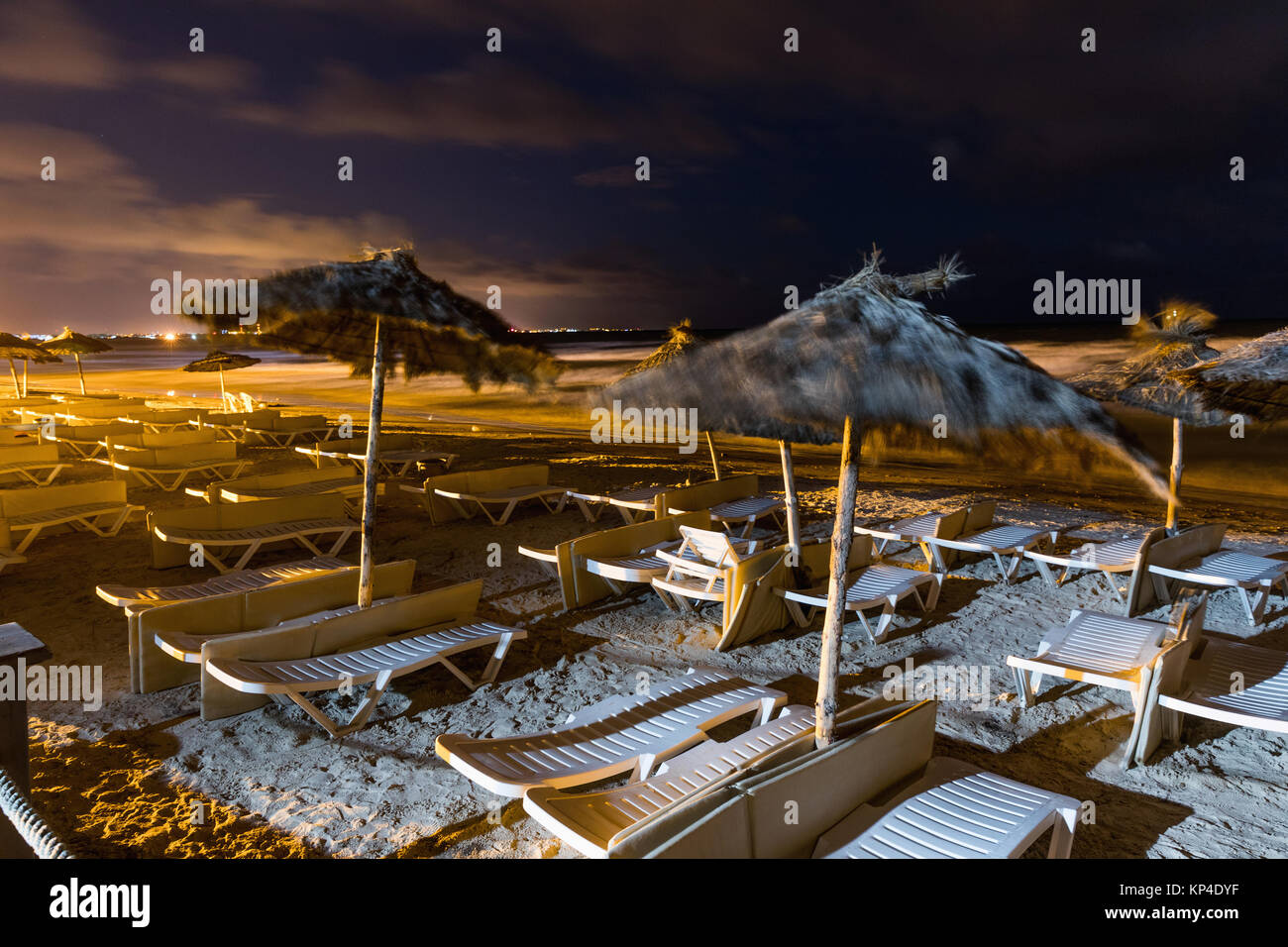Beach at night. Wooden path to the beach, view at night on a beautiful ...