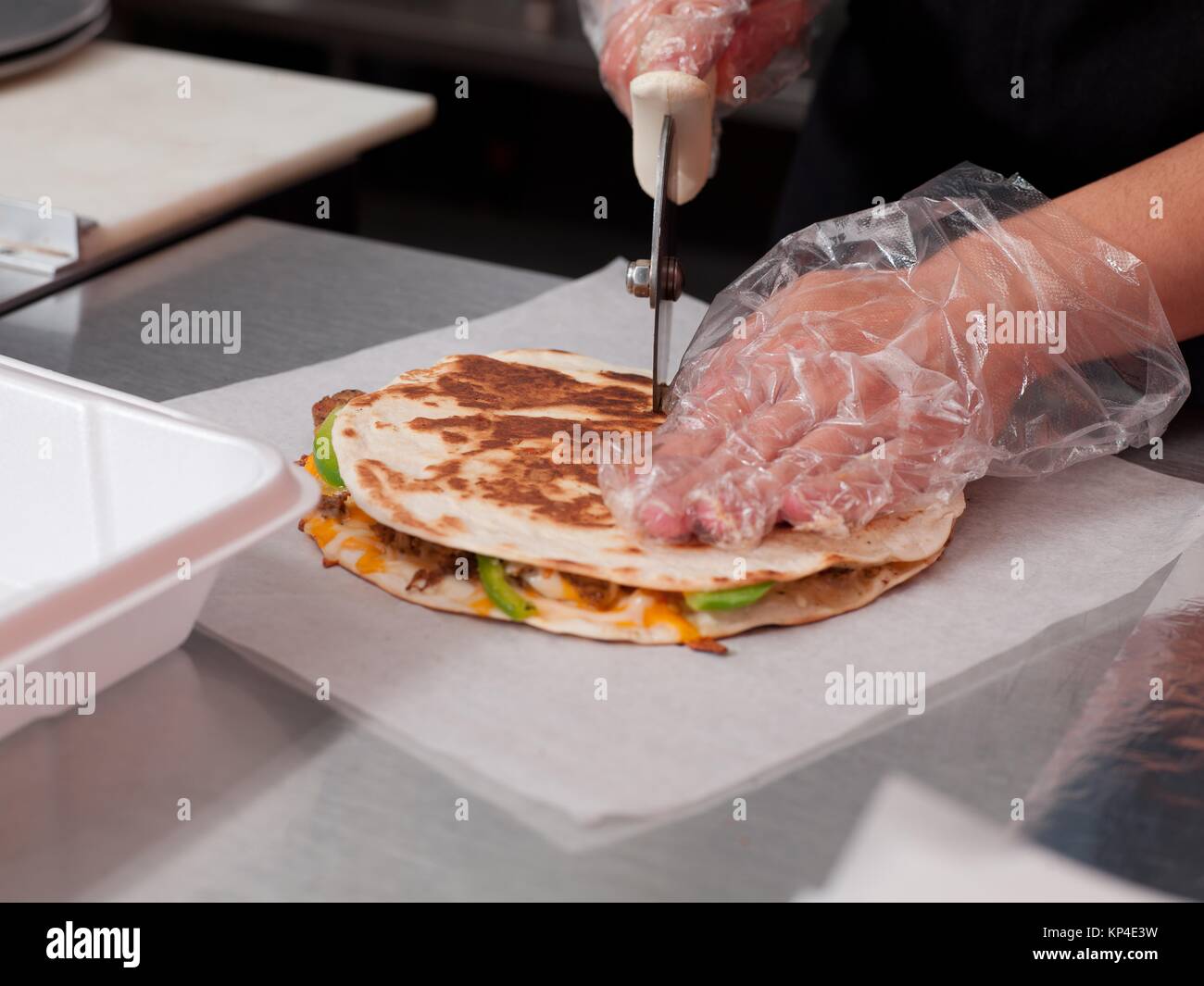 close up of a chef cutting burrito Stock Photo - Alamy