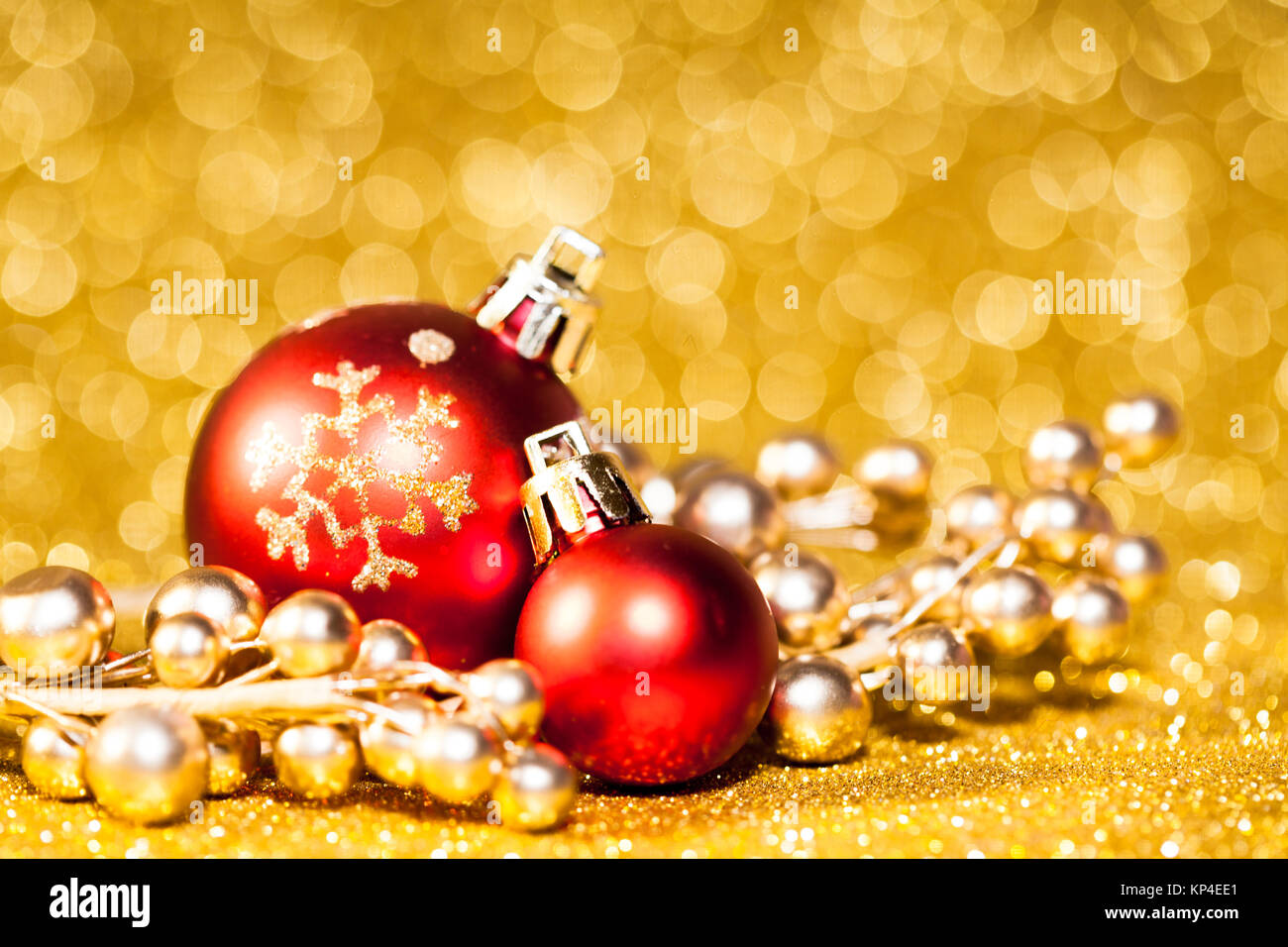 Golden christmas ball on glitter background. studio shot Stock Photo ...