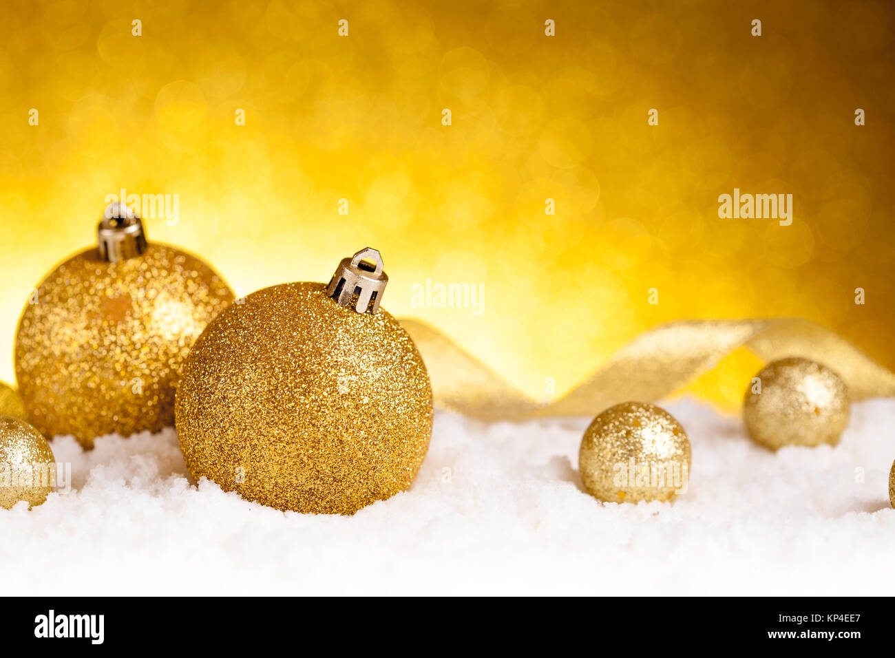 Golden christmas ball on glitter background. studio shot Stock Photo ...
