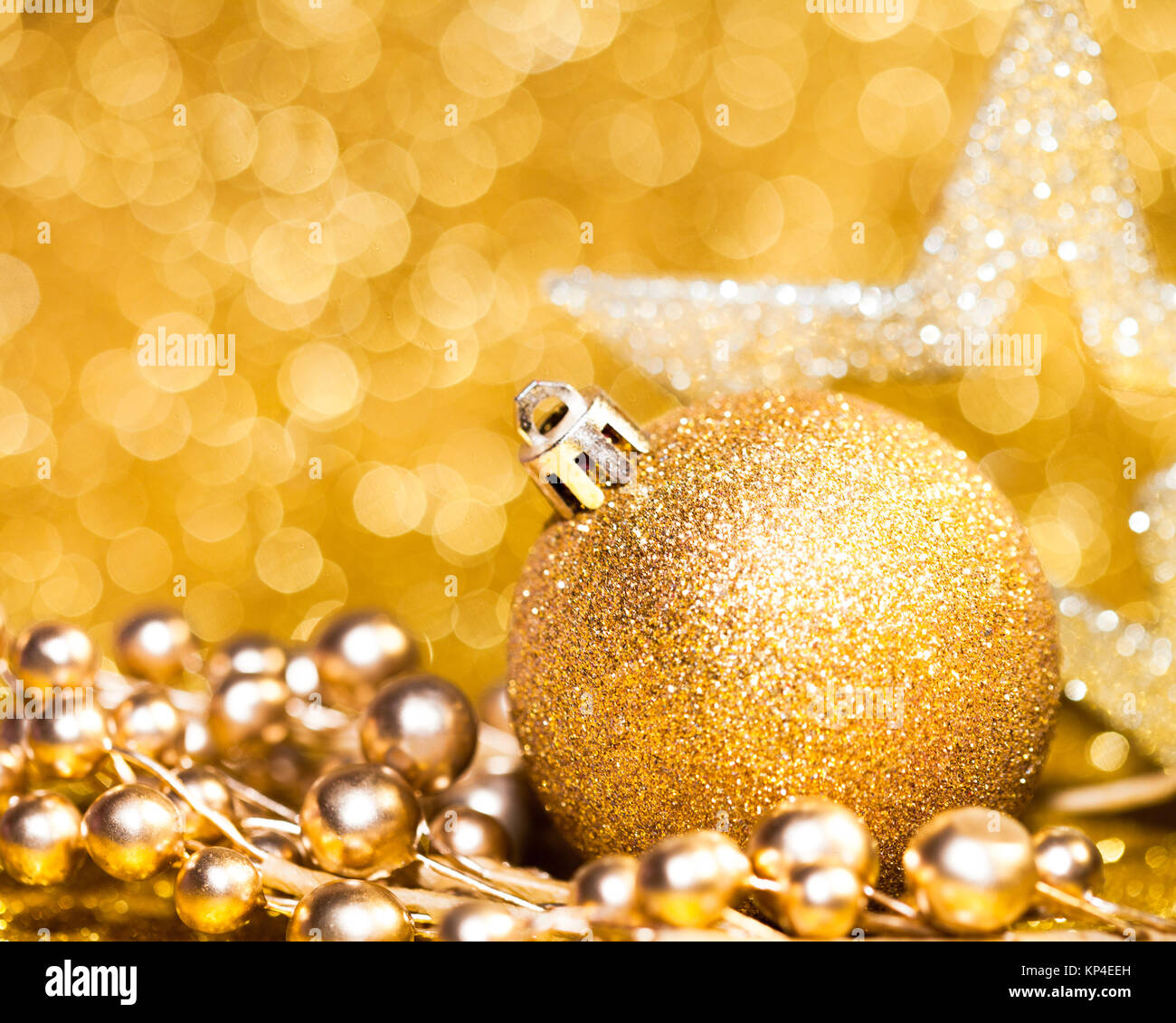 Golden christmas ball on glitter background. studio shot Stock Photo ...