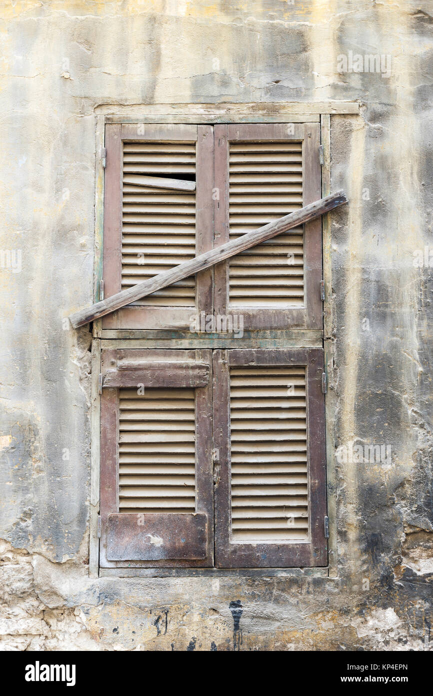 Old wooden window, sealed with wooden planks Stock Photo - Alamy