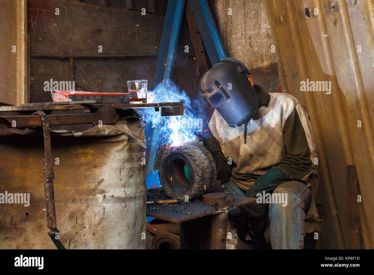 Alexandria, Egypt - March 25 ,2016: Young man welding Stock Photo - Alamy