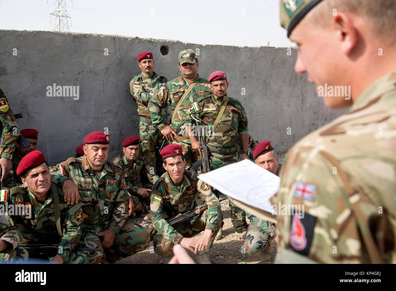 A British army trainer gives instruction during land navigation ...