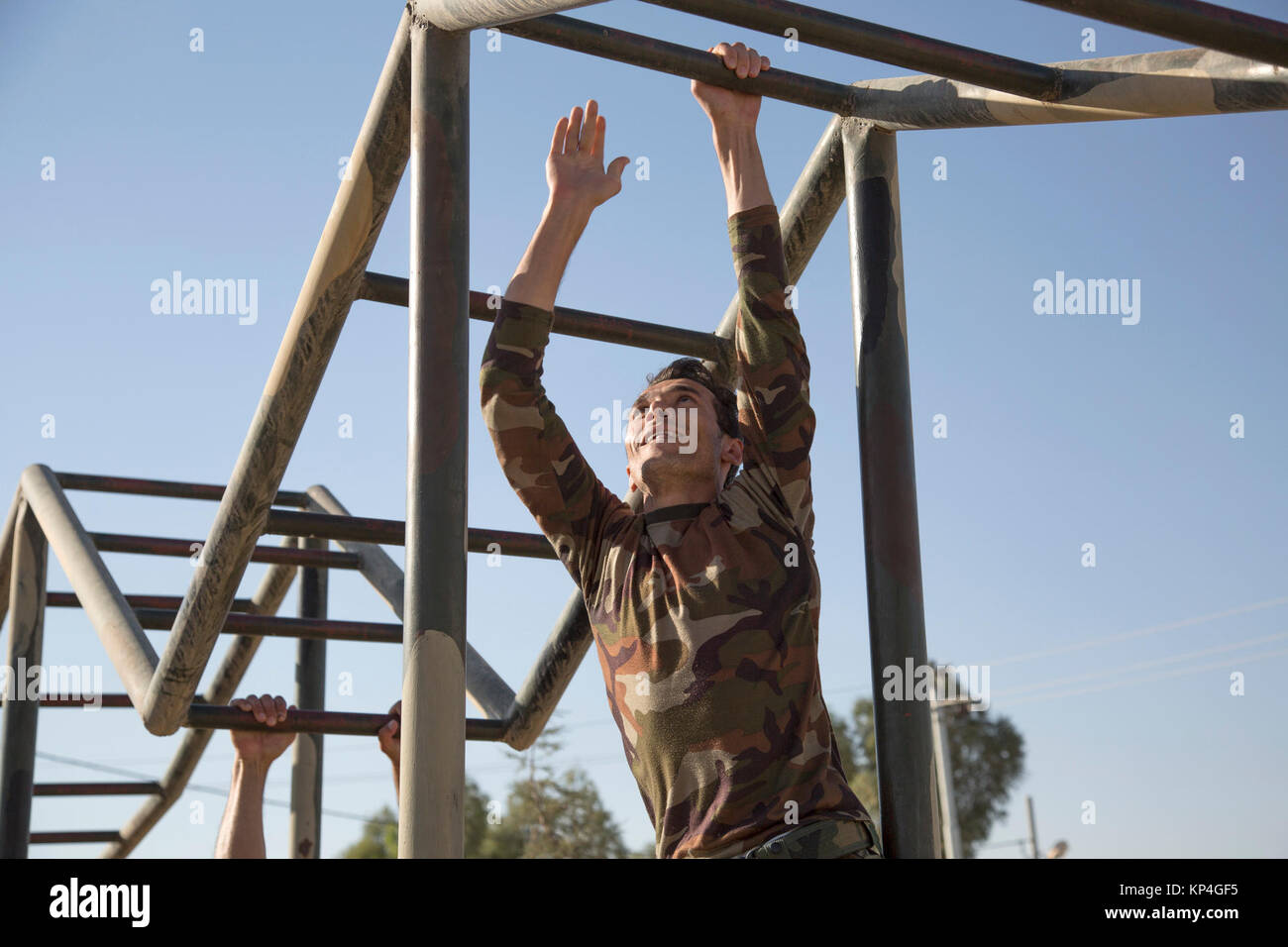 A Peshmerga soldier navigates an obstacle course during physical ...