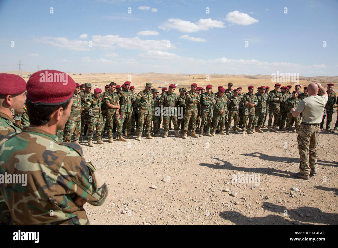 A British army trainer gives instruction to Peshmerga soldiers during ...
