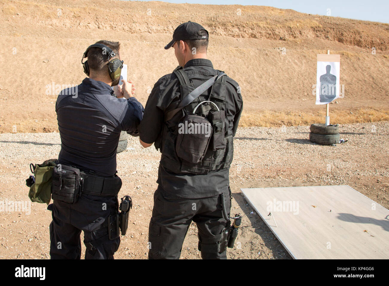 An Asayish member listens to instruction given by an Italian Carabineri ...