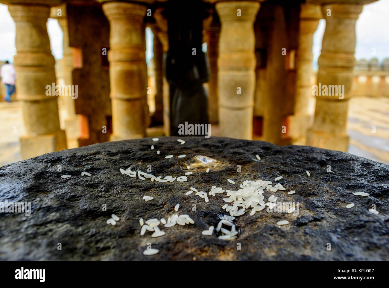 Rice offering in front of Hindu daity Stock Photo - Alamy