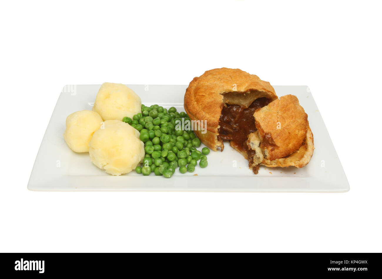 Steak pie mashed potato and peas on a rectangular plate isolated ...