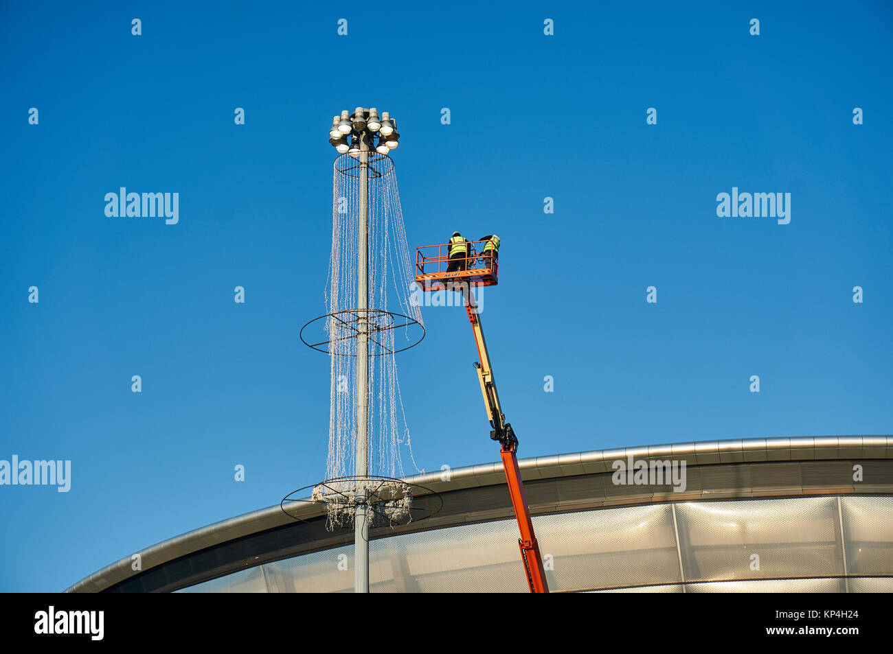 Engineers working at height on an elevated platform Stock Photo - Alamy