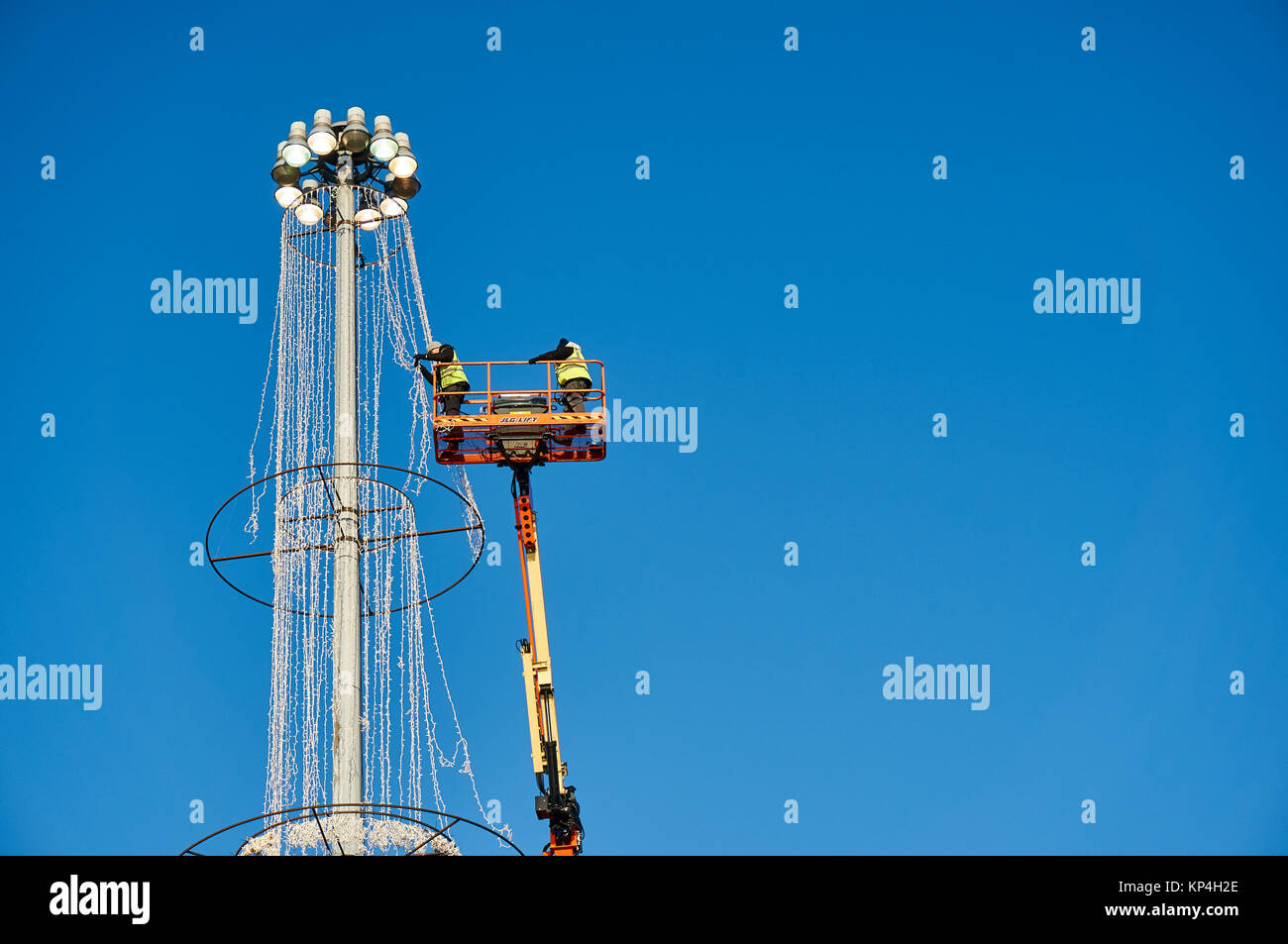 Engineers working at height on an elevated platform Stock Photo - Alamy