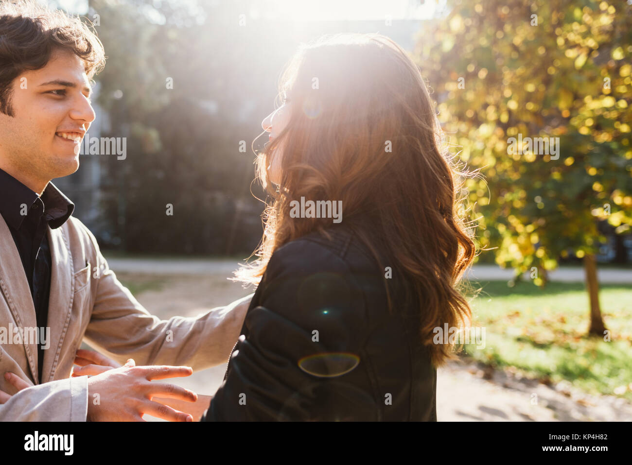 young couple lovers outdoor back light having fun - love, relationship ...