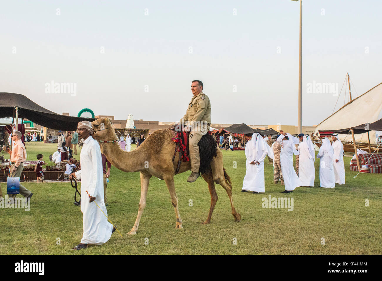 A coalition member rides a camel during the Qatar Emiri Air Force ...