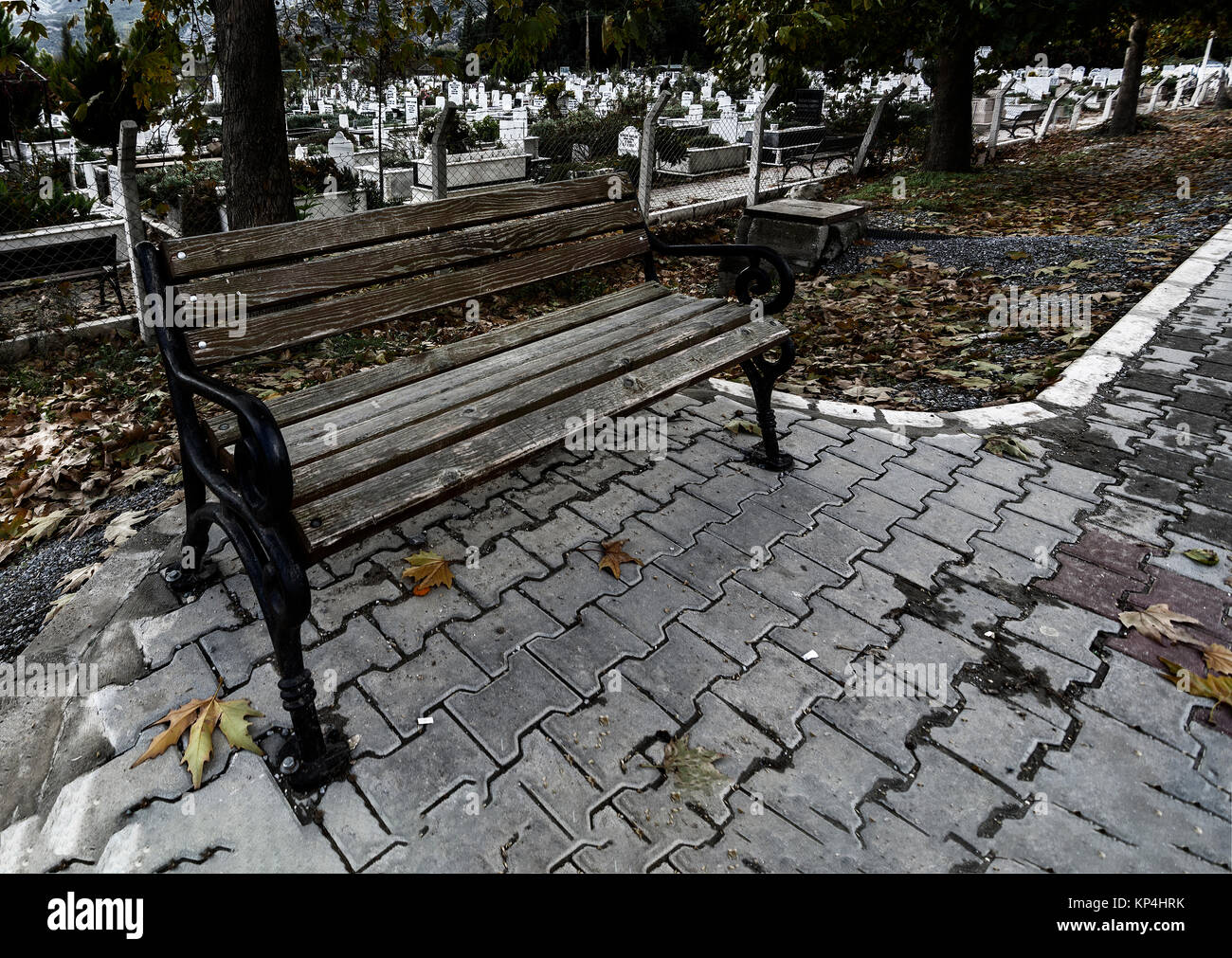 bench waiting in front of the graveyard Stock Photo - Alamy