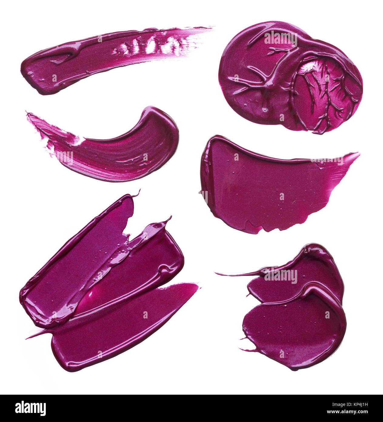 set of smears from various cosmetic products on a white background ...