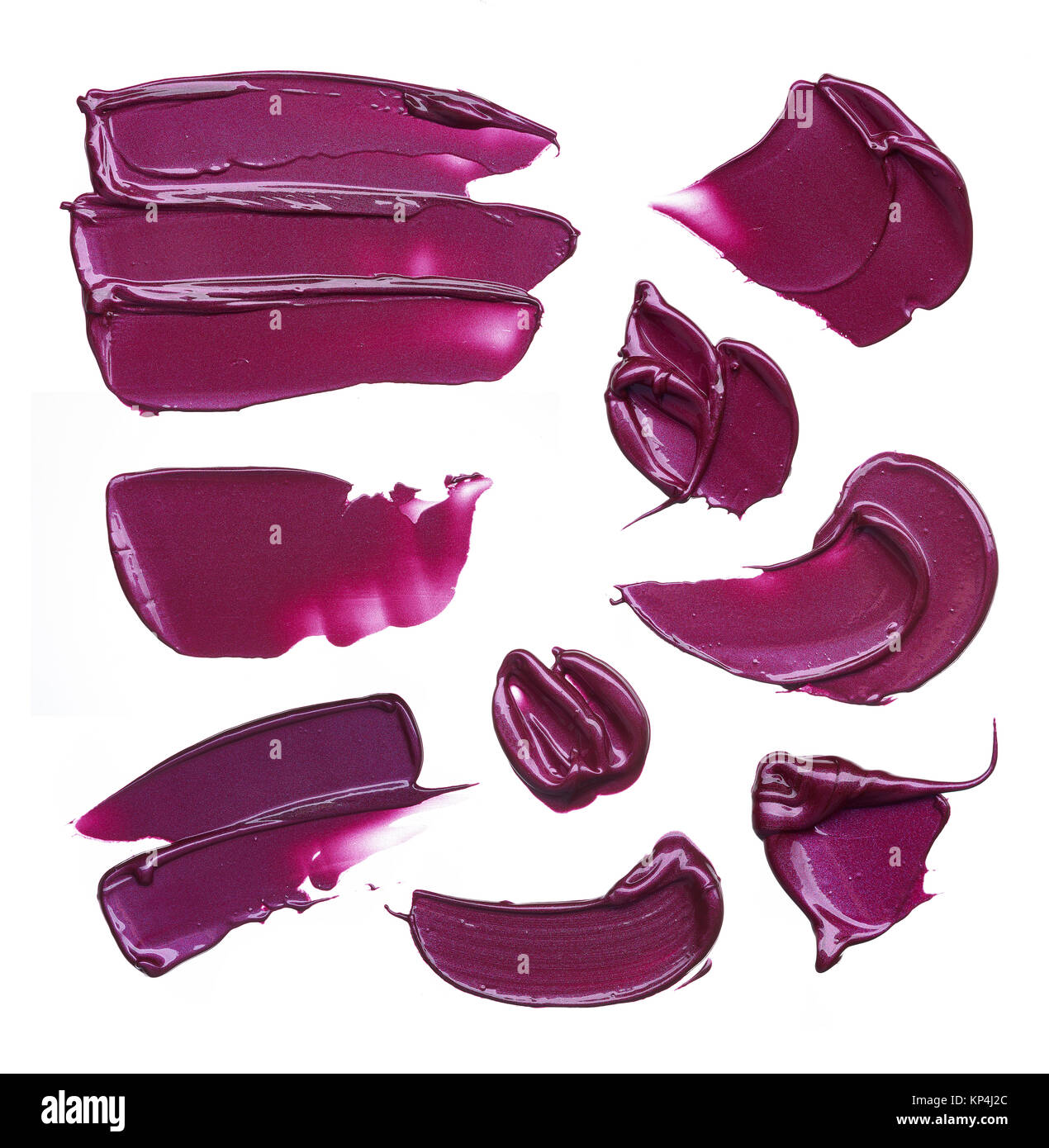 set of smears from various cosmetic products on a white background ...