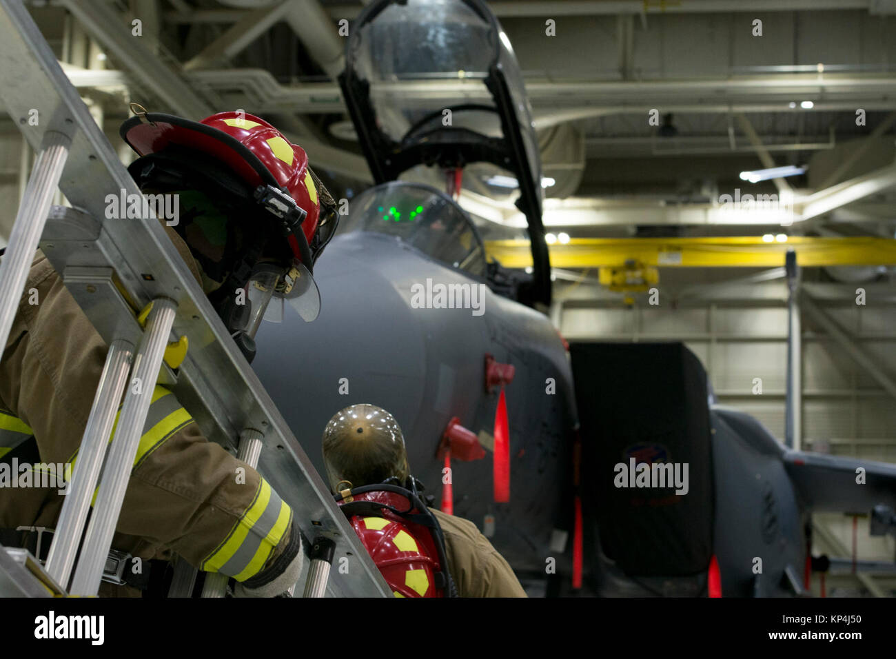 Airmen from the 366th Civil Engineer Squadron pick up a ladder in front ...