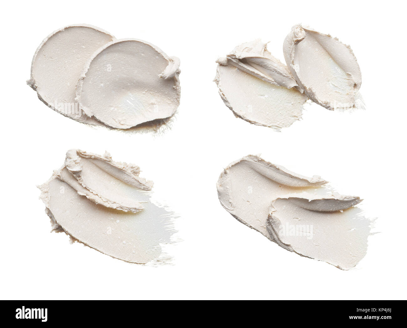 set of smears from various cosmetic products on a white background ...