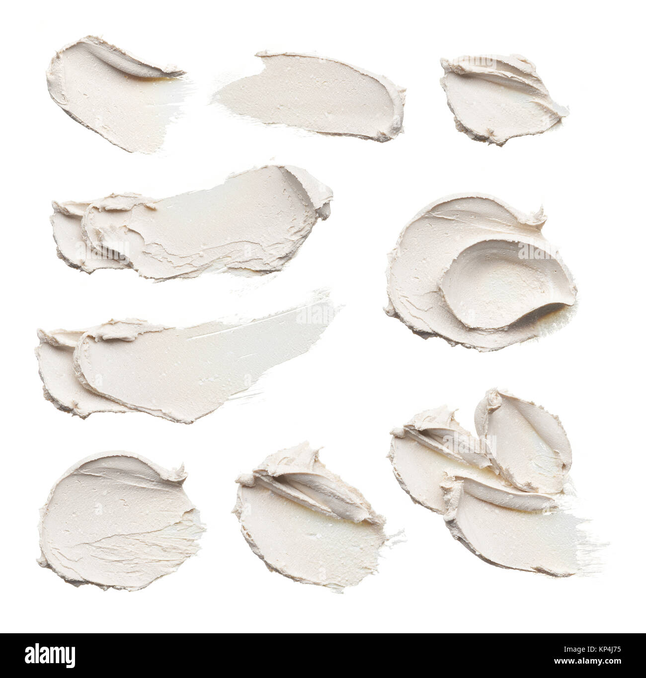 set of smears from various cosmetic products on a white background ...